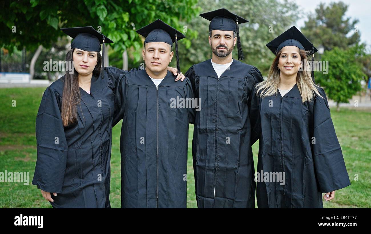 Group of people students graduated smiling confident hugging each other ...