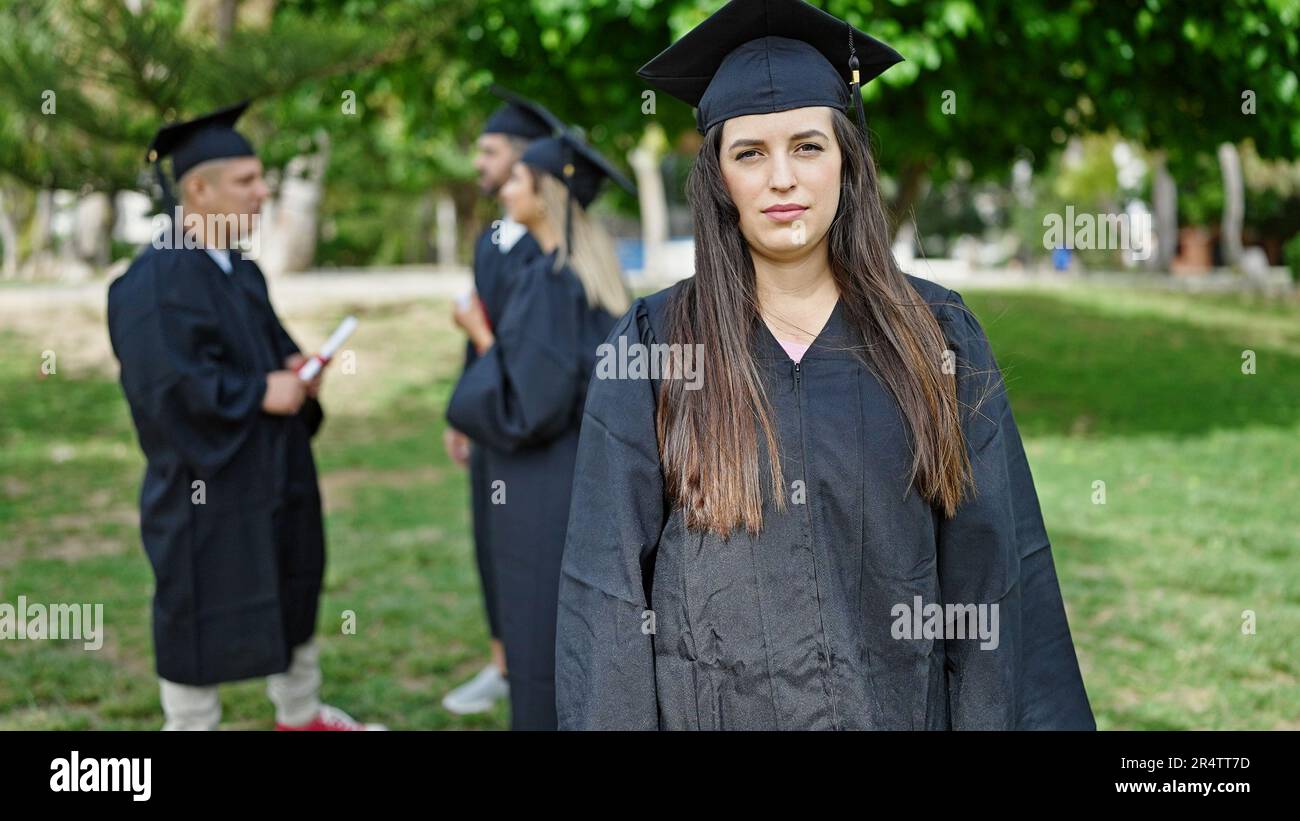 Group of people students graduated standing with relaxed expression at ...