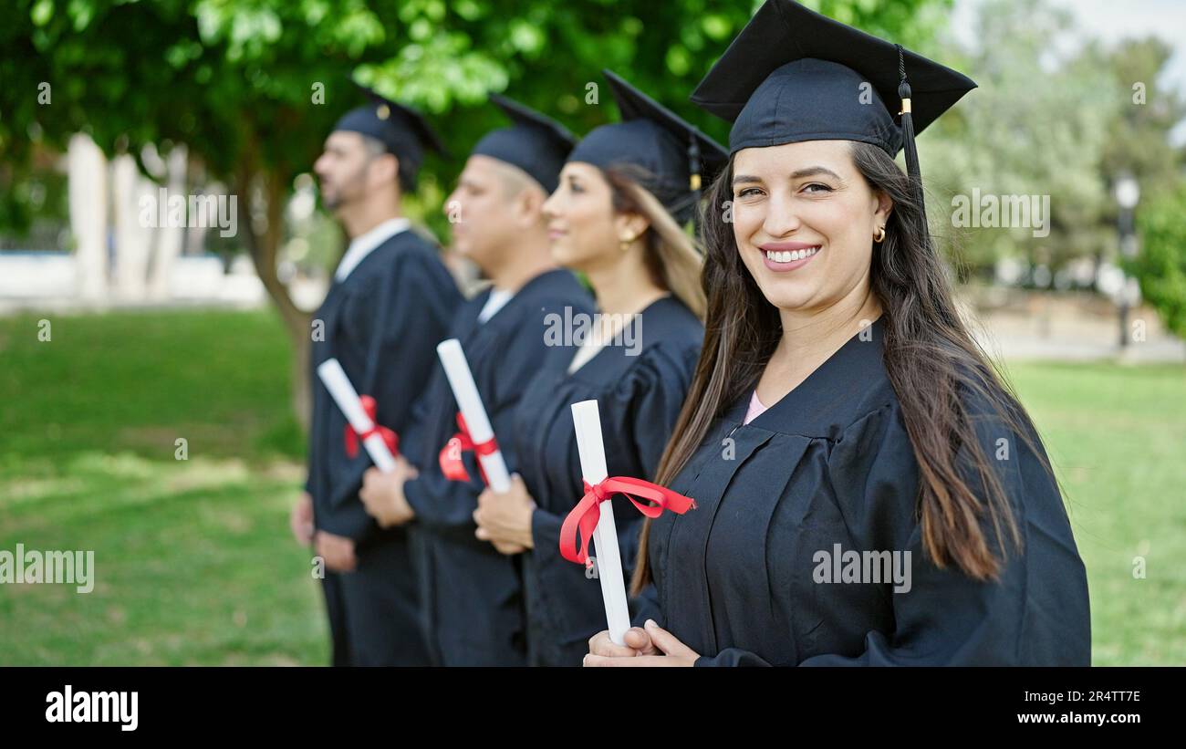 Group of people students graduated holding diploma at university campus ...