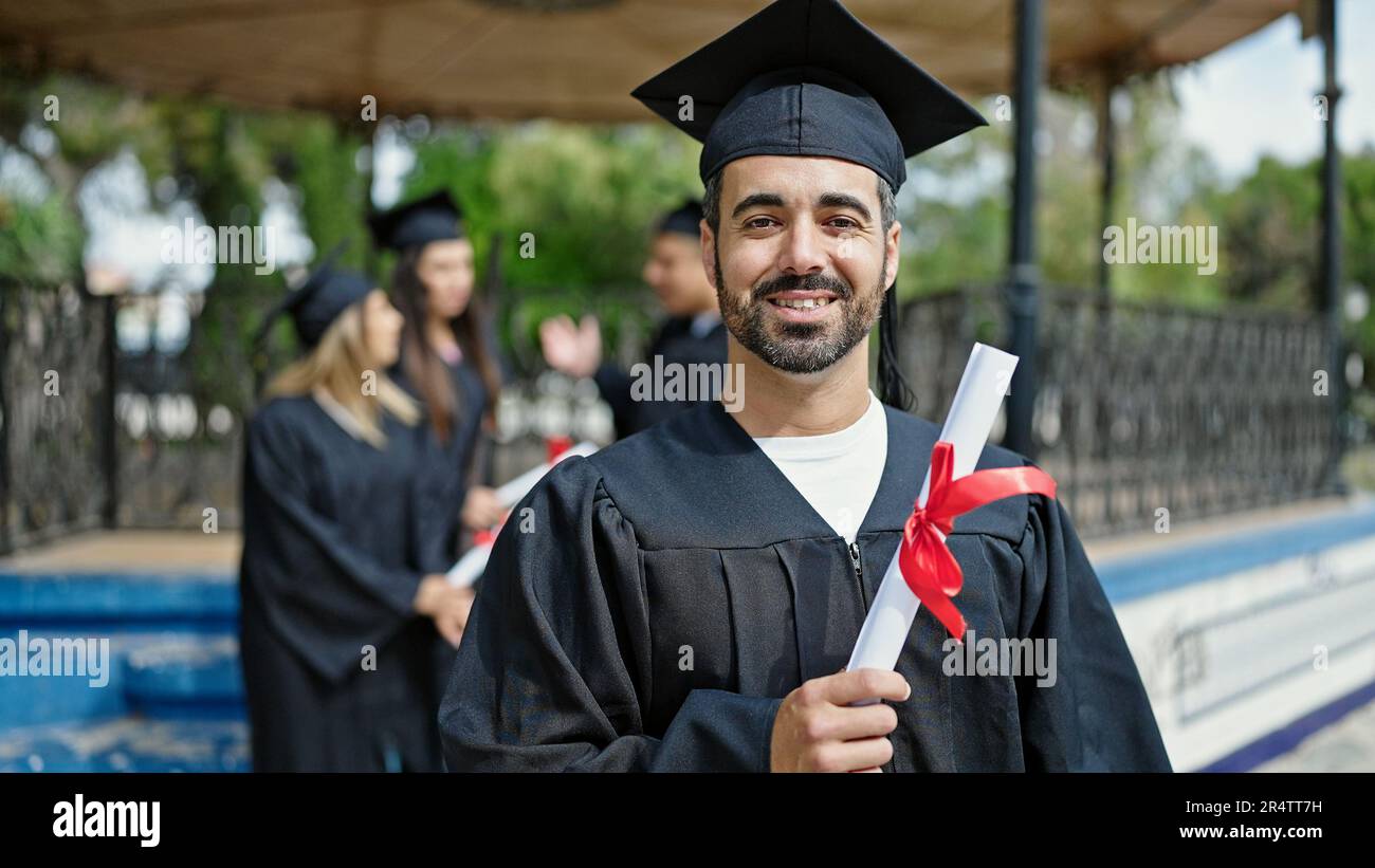 Group of people students graduated holding diploma at university campus ...