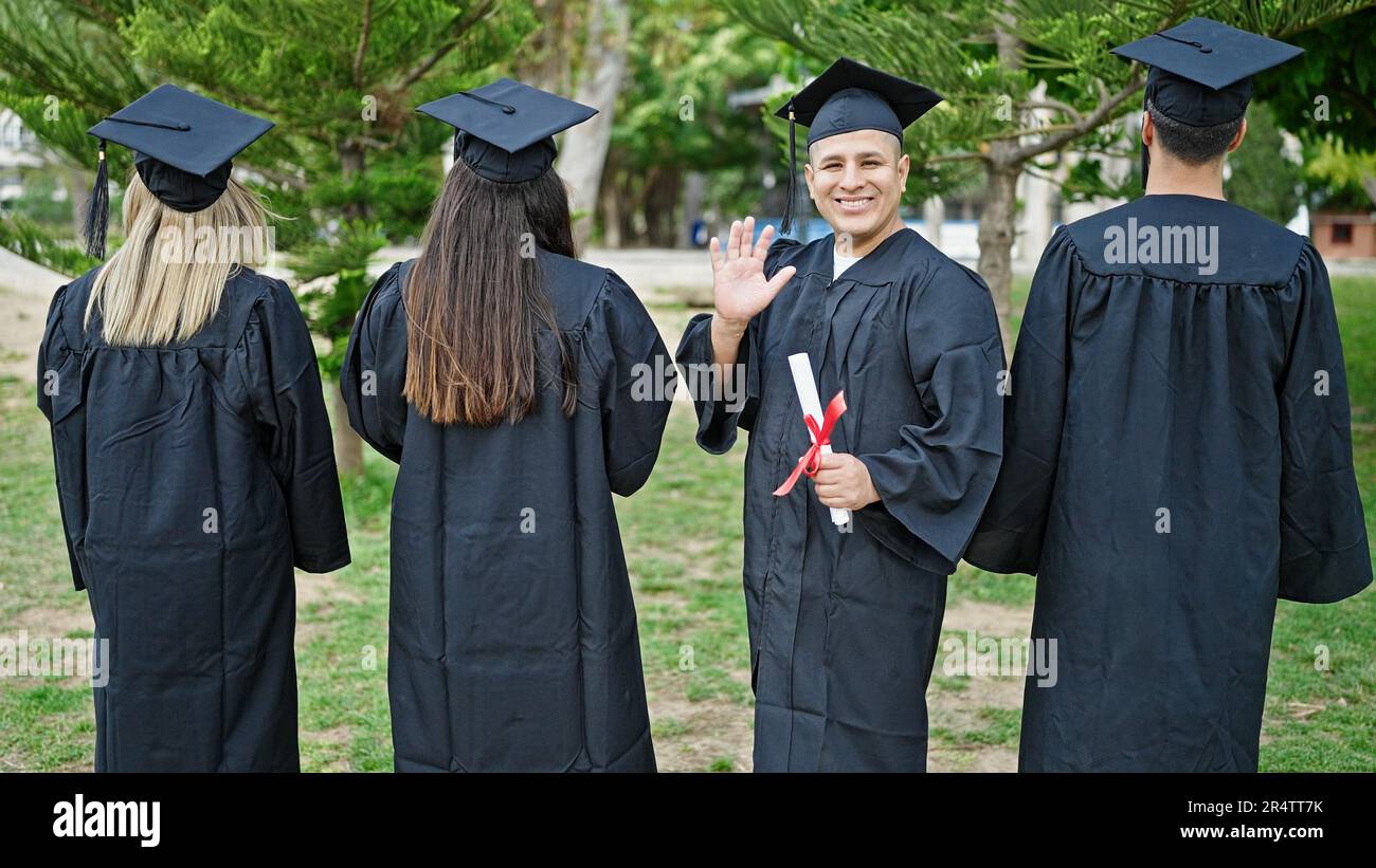 Group of people students graduated holding diploma saying hello with ...