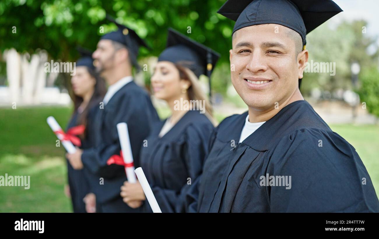 Group of people students graduated holding diploma at university campus ...