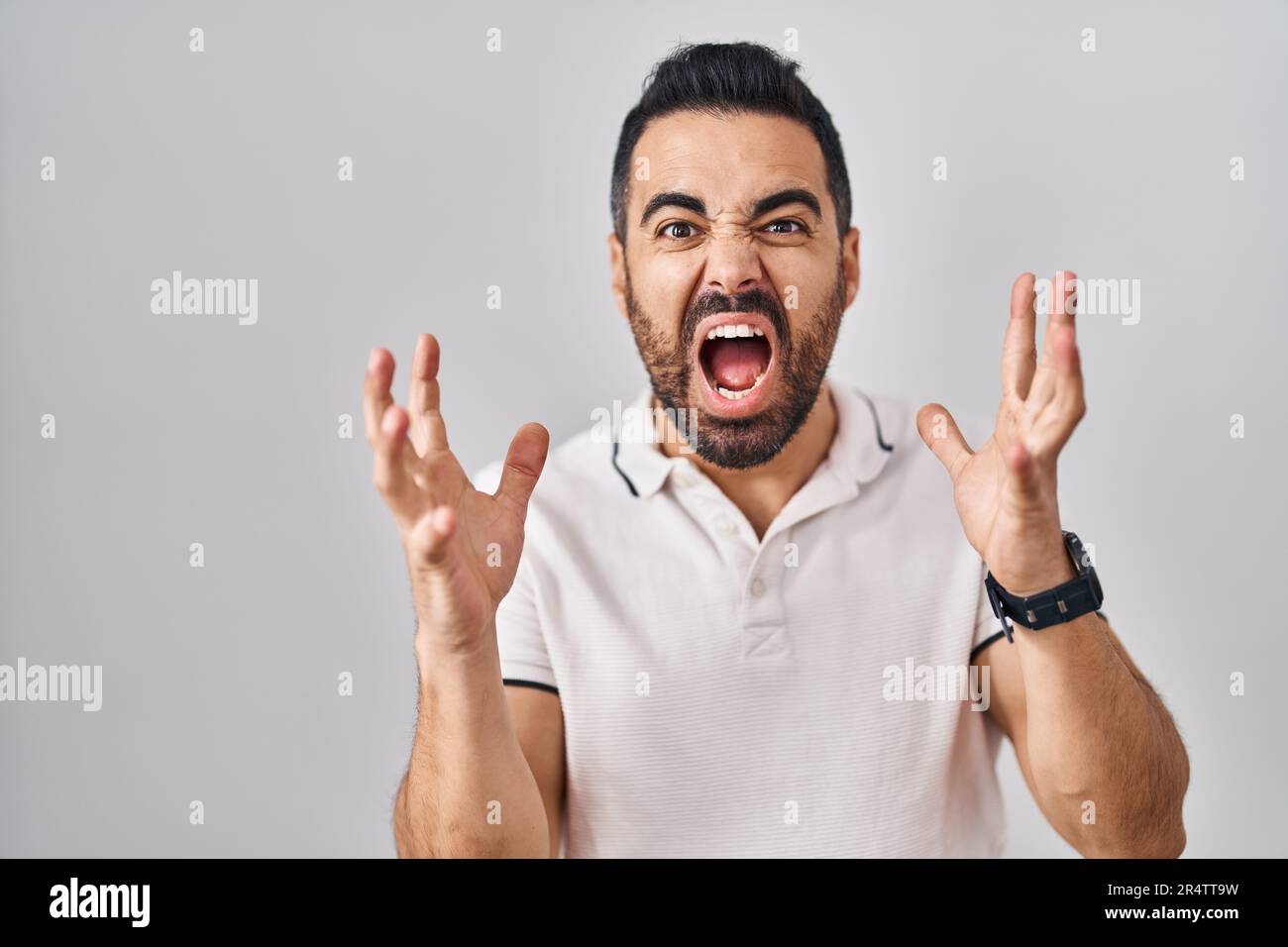 Young hispanic man with beard wearing casual clothes over white ...