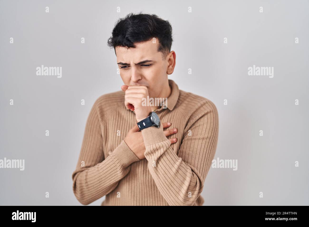 Non binary person standing over isolated background feeling unwell and ...