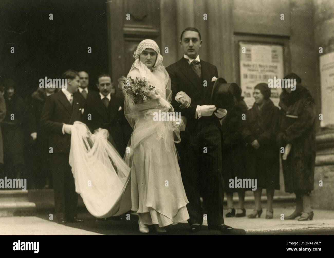 The bride and the groom outside the church, Italy 1930s Stock Photo - Alamy