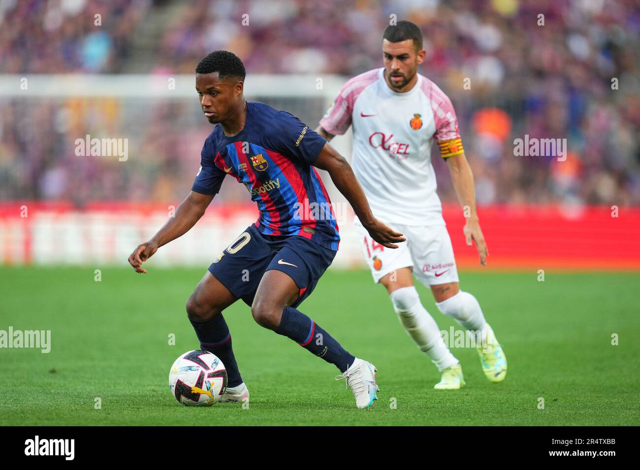 Ansu Fati of FC Barcelona and Dani Rodriguez of RCD Mallorca during the ...