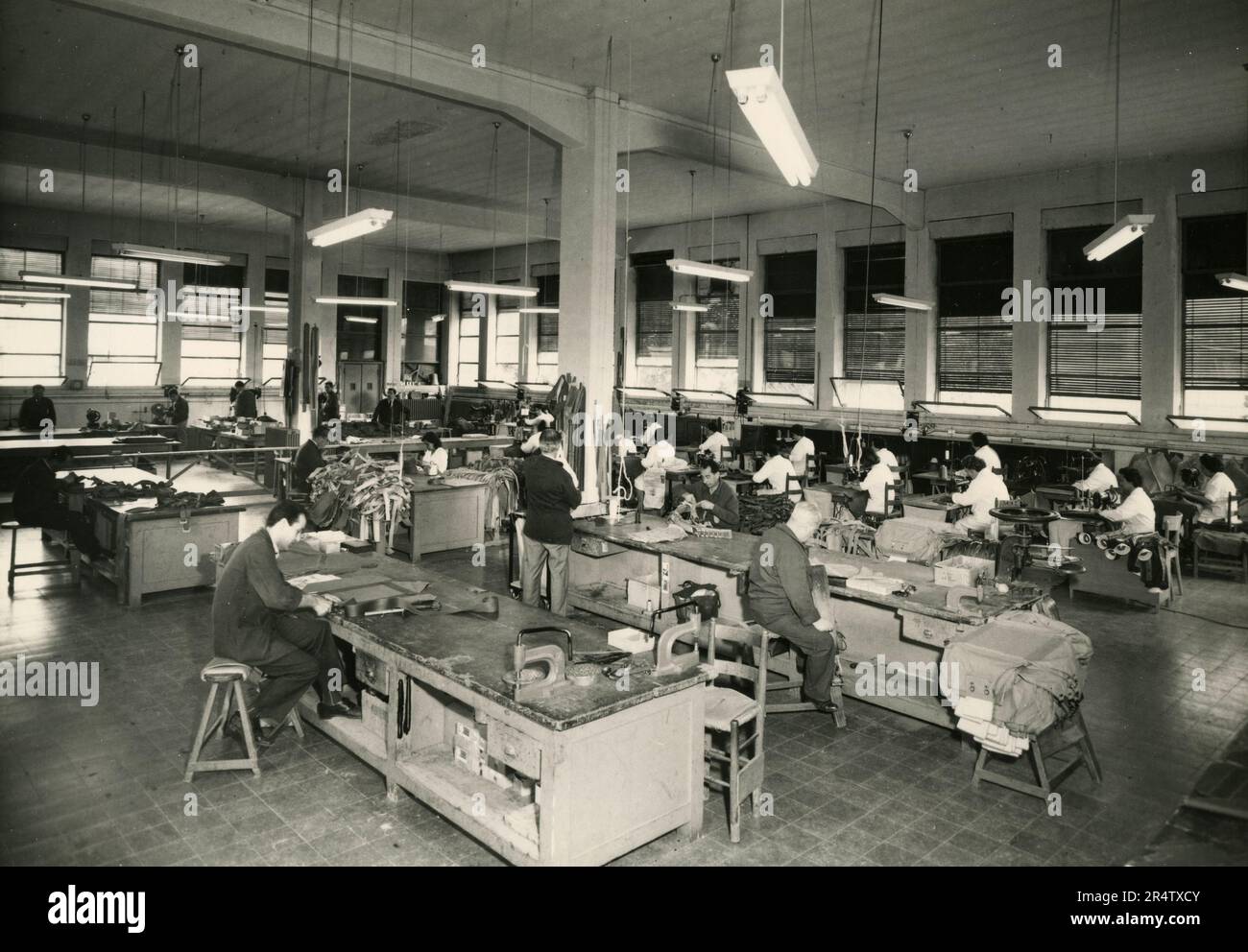 Men and women at work in the leather factory, Italy 1960s Stock Photo ...