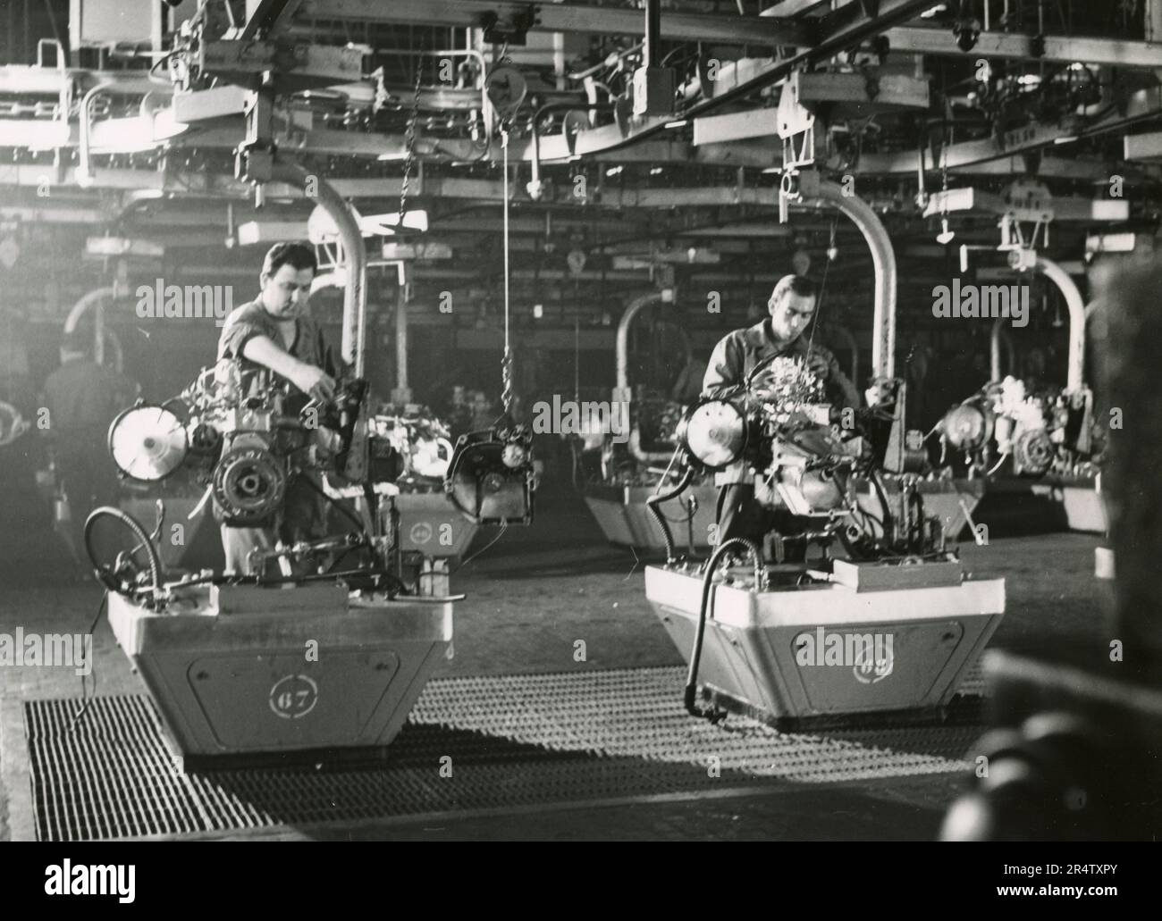 Men at work checking the working characteristics of fully-assembled ...