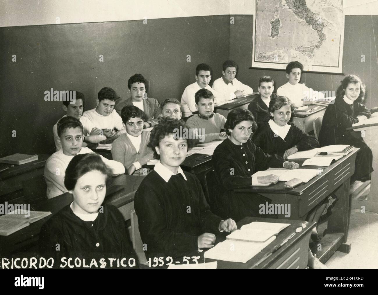 Boys and girls in the classroom sitting at the desks, Italy 1952 Stock ...