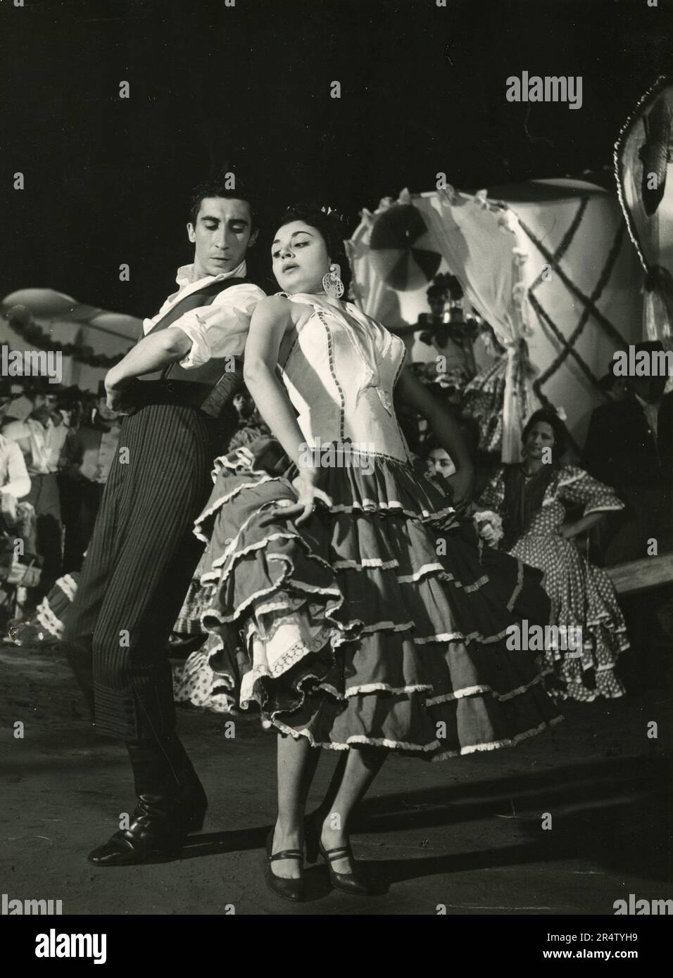 Couple wearing traditional Spanish dress dancing Flamenco, Spain 1970s ...