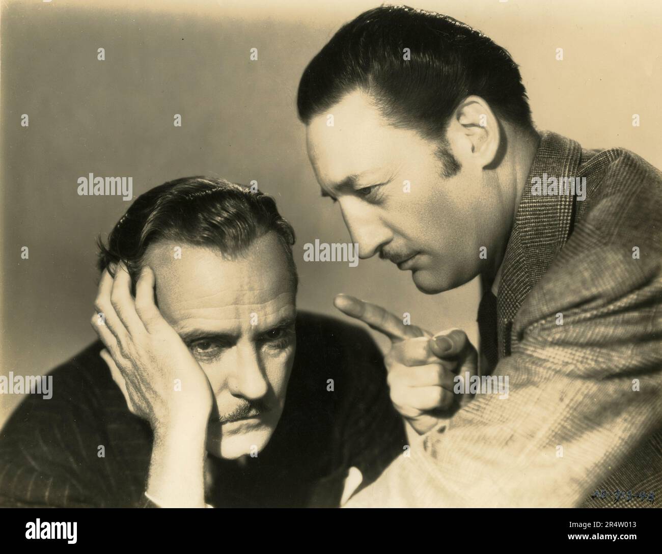 Actors Ralph Morgan and Warren Williams in the movie Wives Under ...