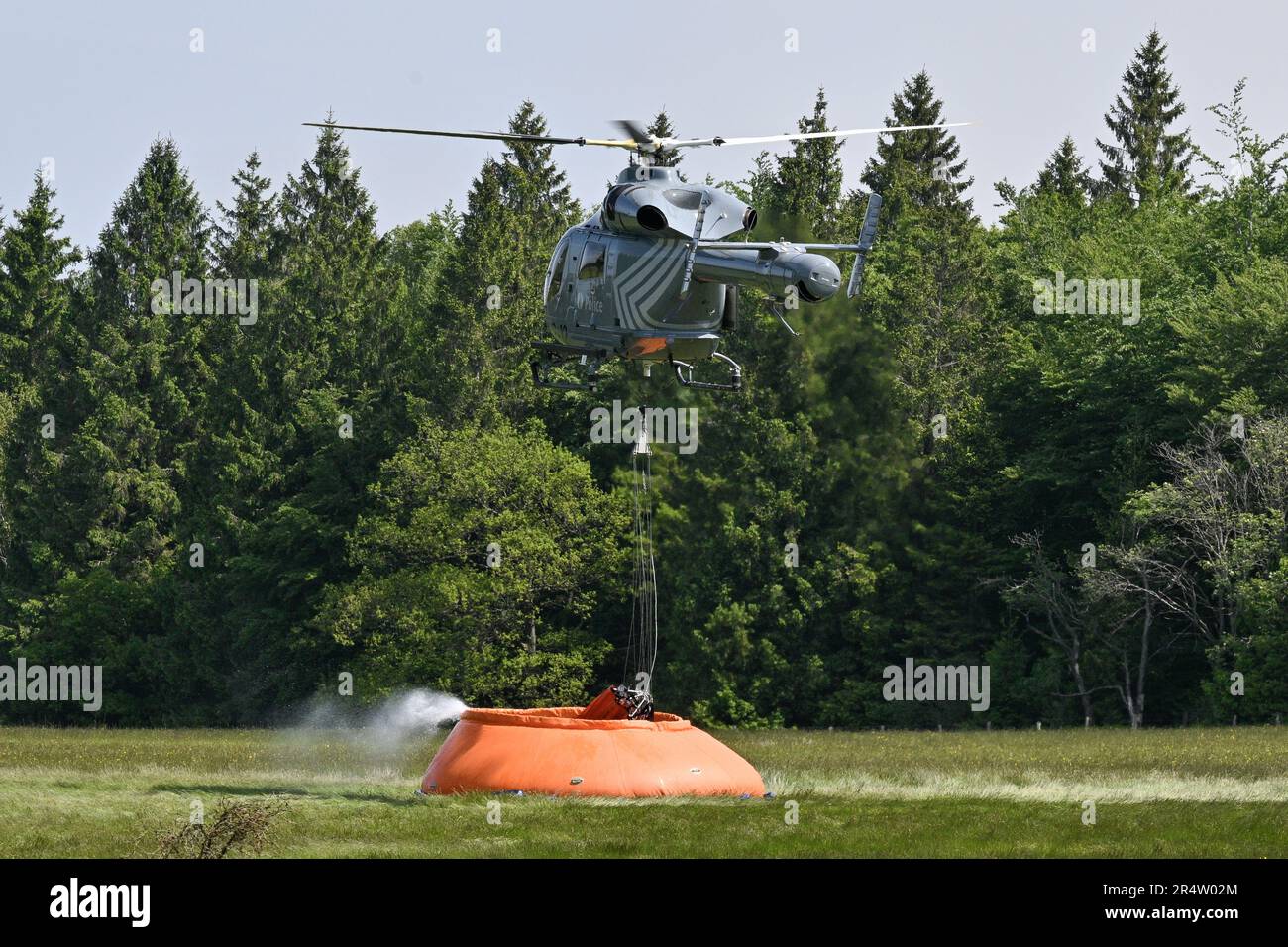Illustration picture shows a helicopter filling up with water at the ...