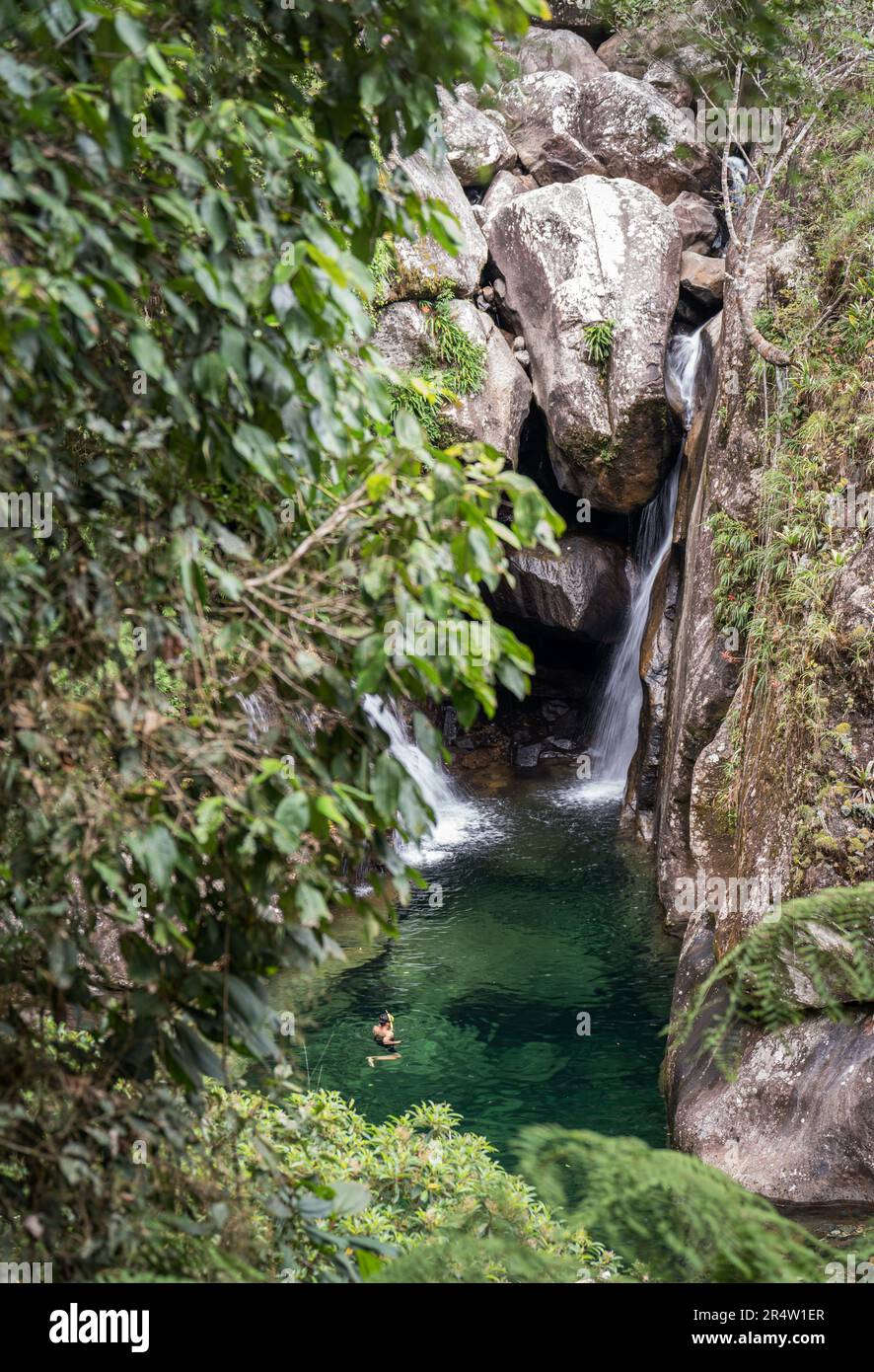 Refreshing Green Waterfall Bath in Remote Tropical Rainforest Stock ...