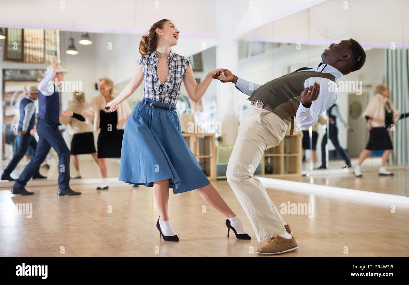 Woman and man dancing swing in studio Stock Photo - Alamy