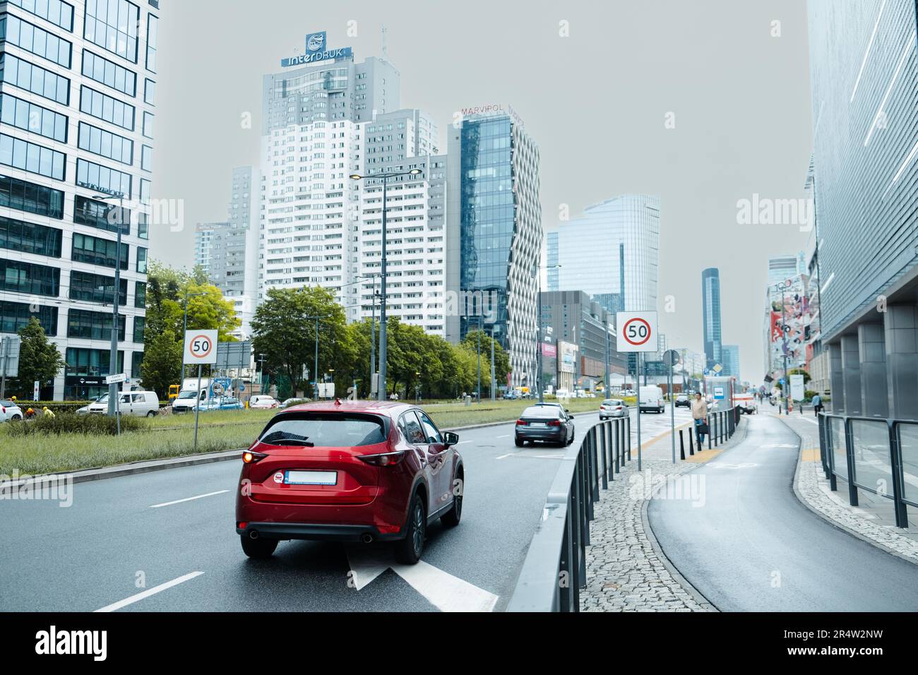Driving in modern city center Stock Photo - Alamy