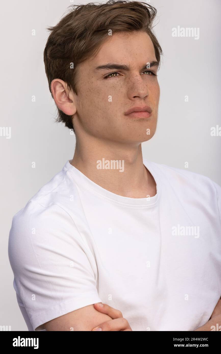 White background studio portrait of a handsome cool boy teenager teen ...