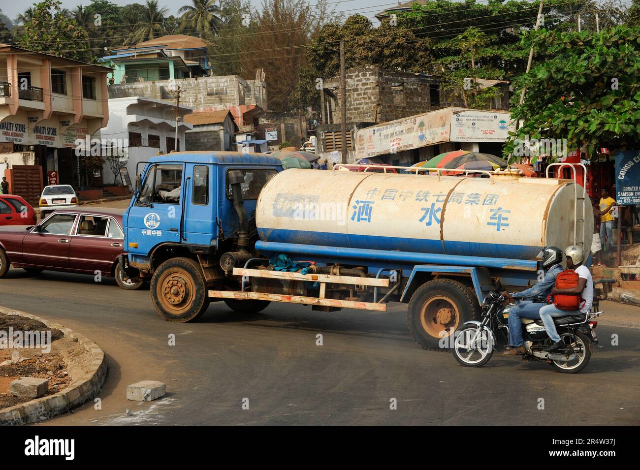 SIERRA LEONE, Freetown, water tanker truck of chinese road construction ...