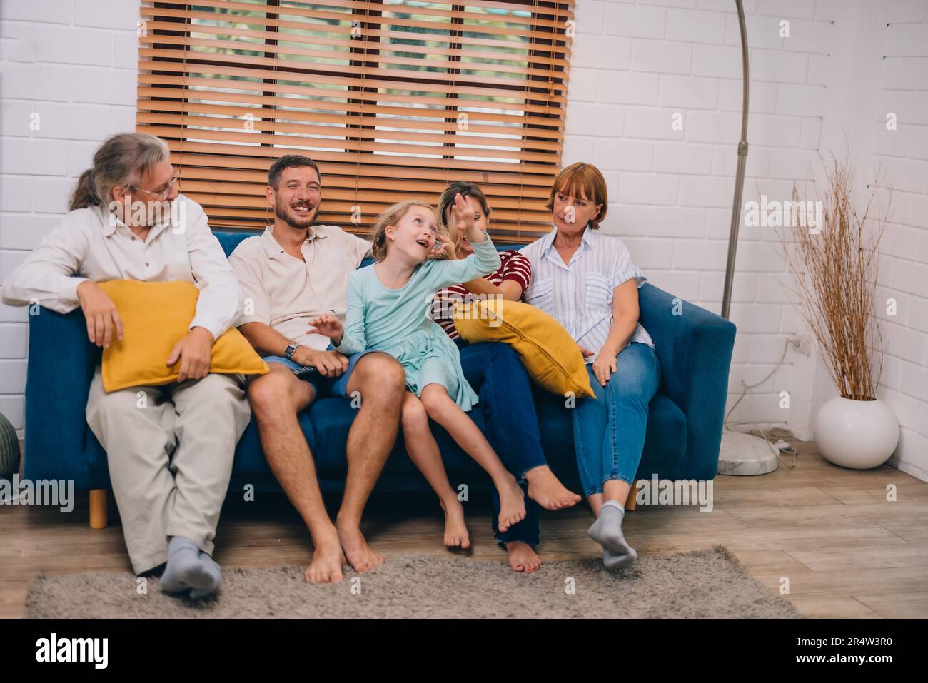 Members of the family from multiple generations enjoy quality time ...