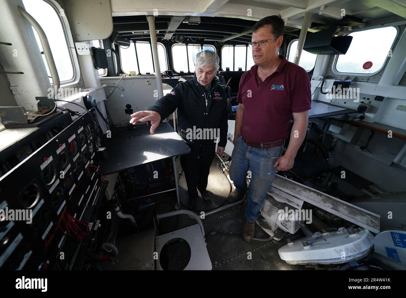 Martyn Steedman alongside David Buchan from the RNLI in the wheelhouse ...