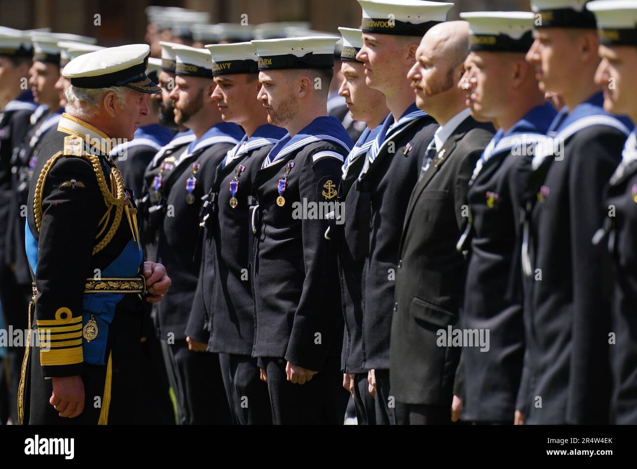 King Charles III presents the Royal Victorian Order to members of the ...
