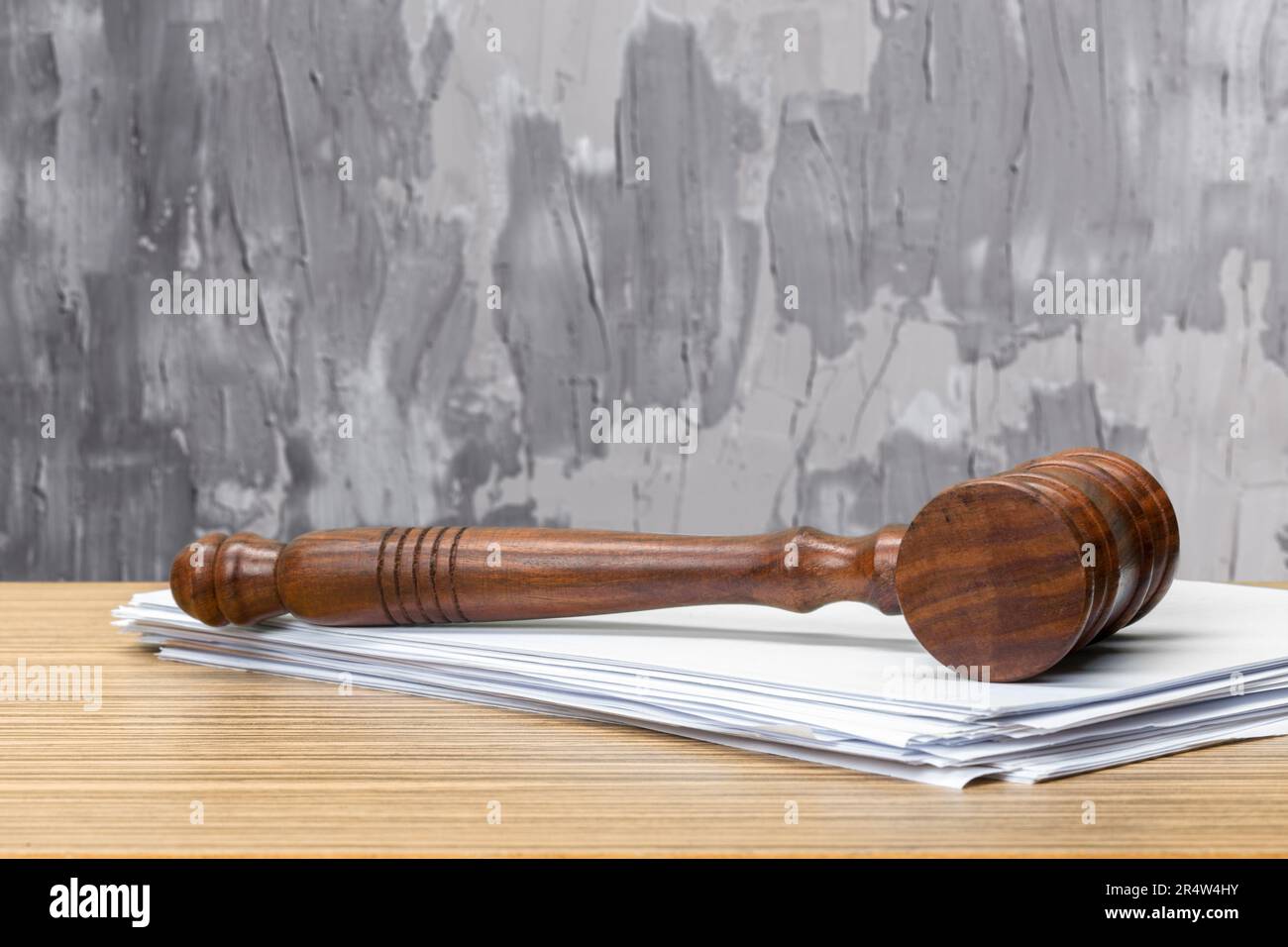 judge hammer on white paper and table Stock Photo - Alamy