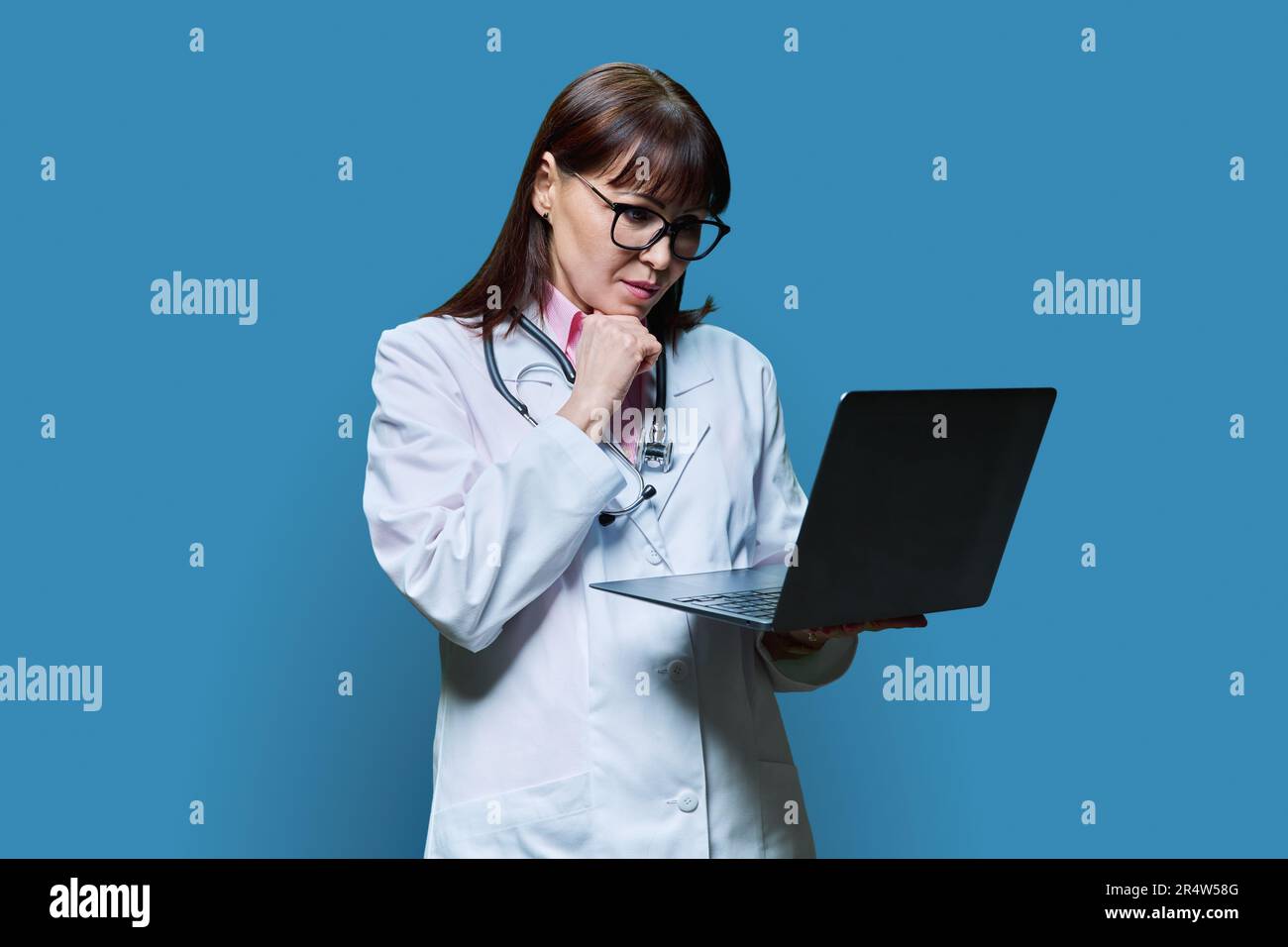 Mature female doctor using hi-res stock photography and images - Alamy