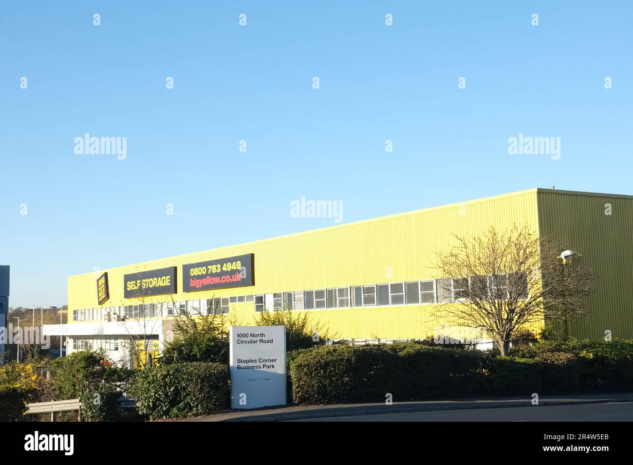 A yellow warehouse under a clear blue sky makes a powerful statement in ...