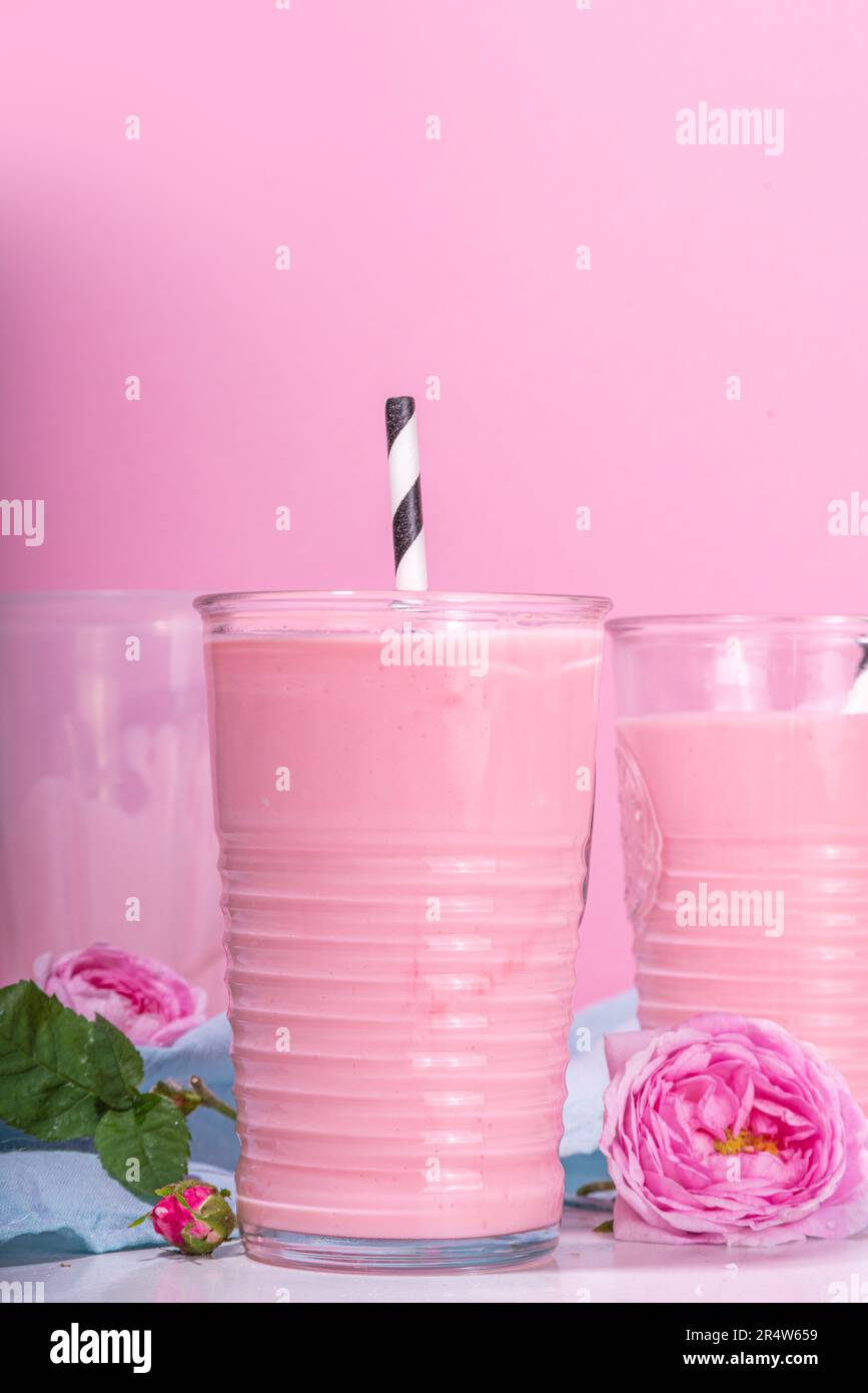 Rose flower milkshake, asian Moon milk drink. Pink matcha cocktail with ...