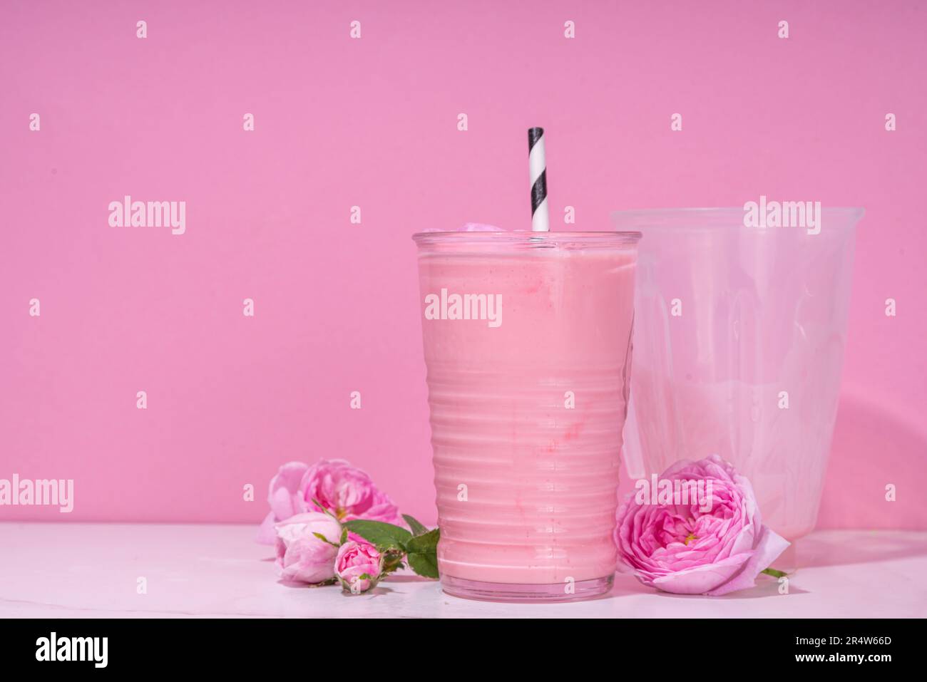 Rose flower milkshake, asian Moon milk drink. Pink matcha cocktail with ...