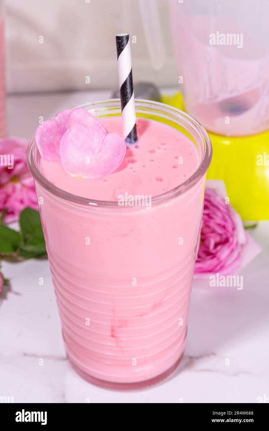 Rose flower milkshake, asian Moon milk drink. Pink matcha cocktail with ...