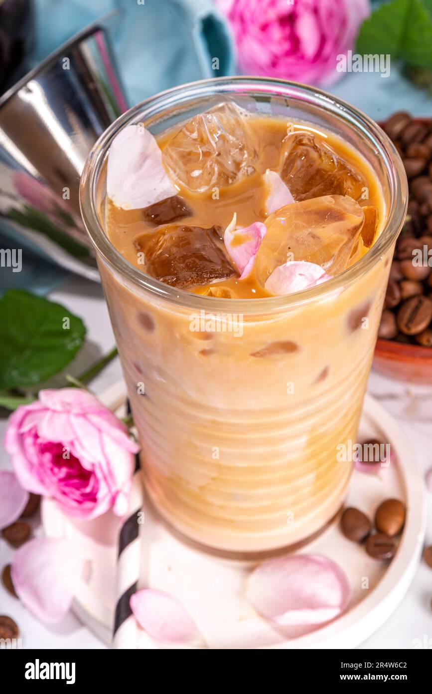 Iced Rose flower latte coffee drink, with pink rose petals taste almond ...