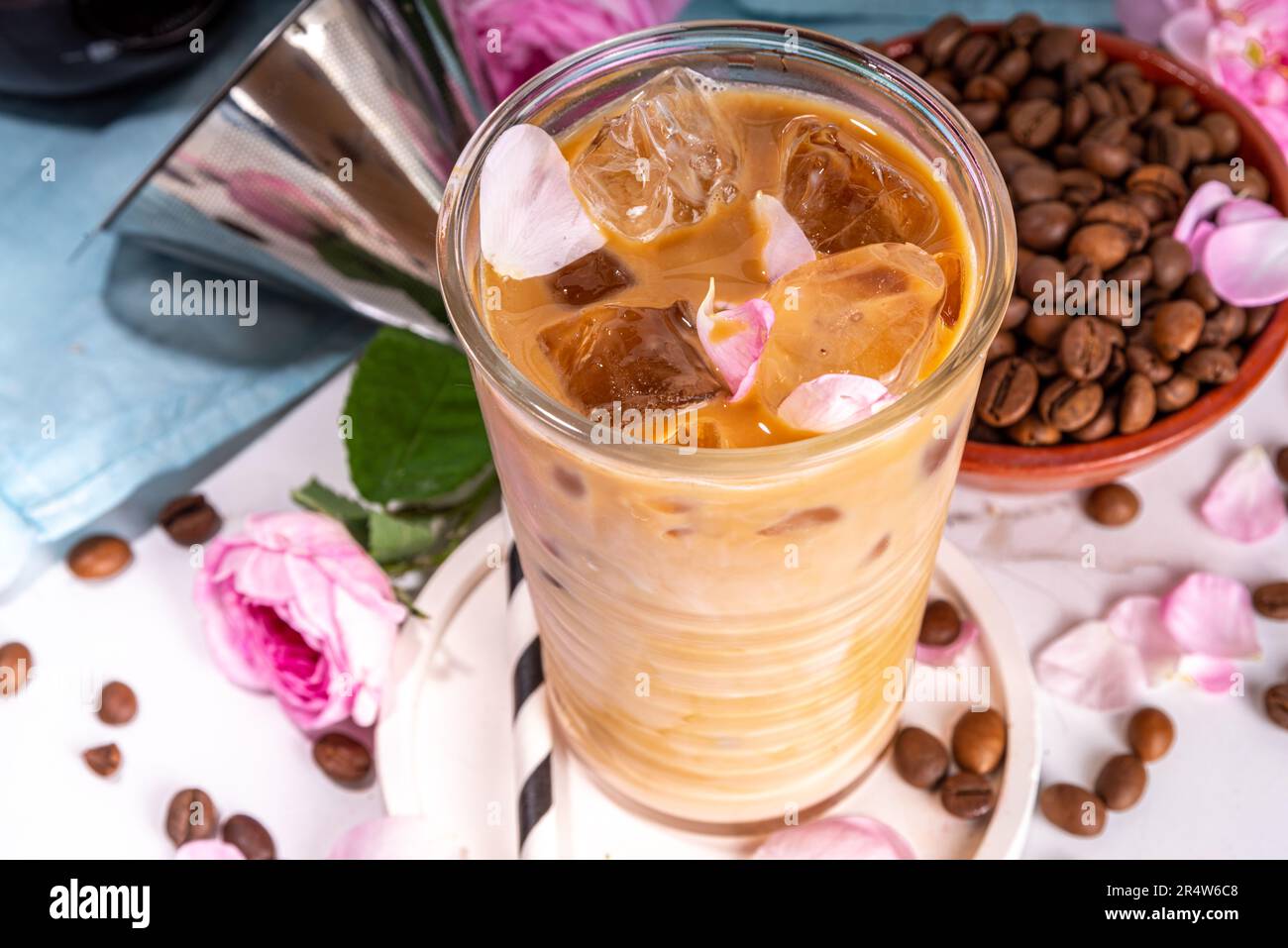 Iced Rose flower latte coffee drink, with pink rose petals taste almond ...