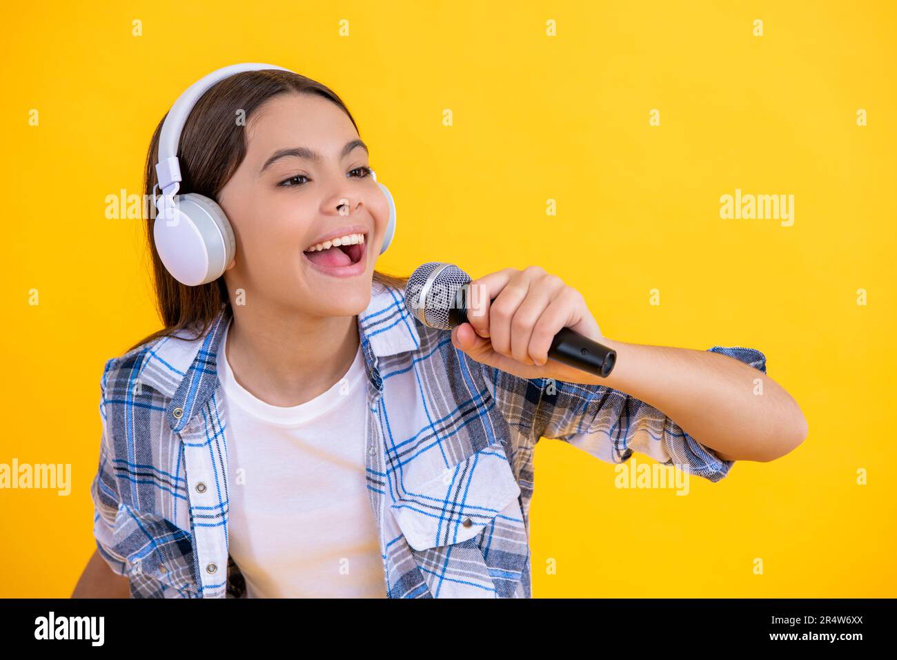 happy teenage singer girl singing music on background. singer girl with ...