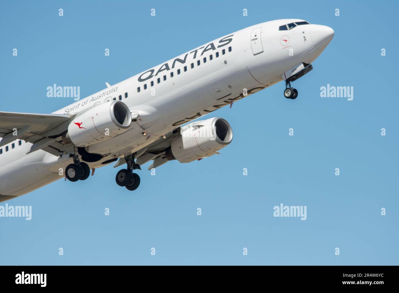 commercial planes flying near airport Stock Photo - Alamy