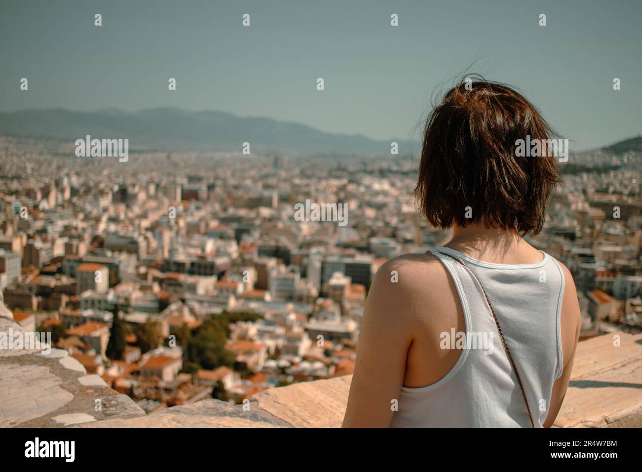 Woman look city sunset view hi-res stock photography and images - Alamy