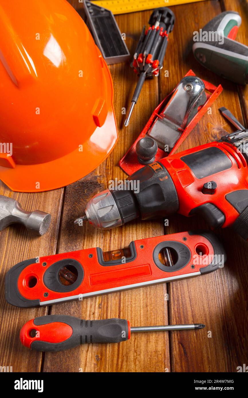 Assorted work tools on wood background Stock Photo - Alamy