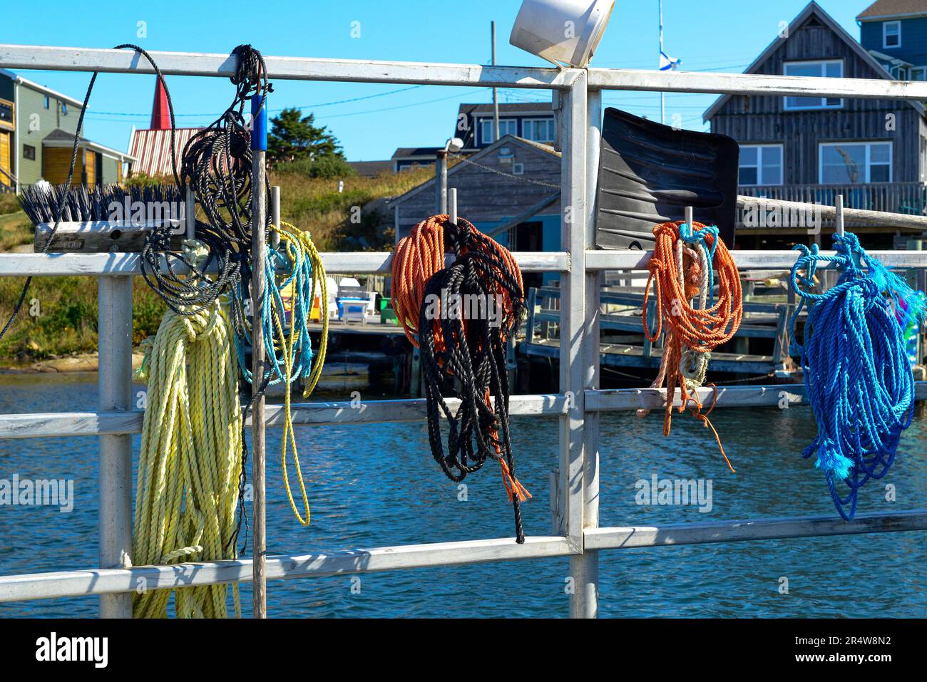 Heavy duty braided industrial fishing rope coiled. A large thick worn ...