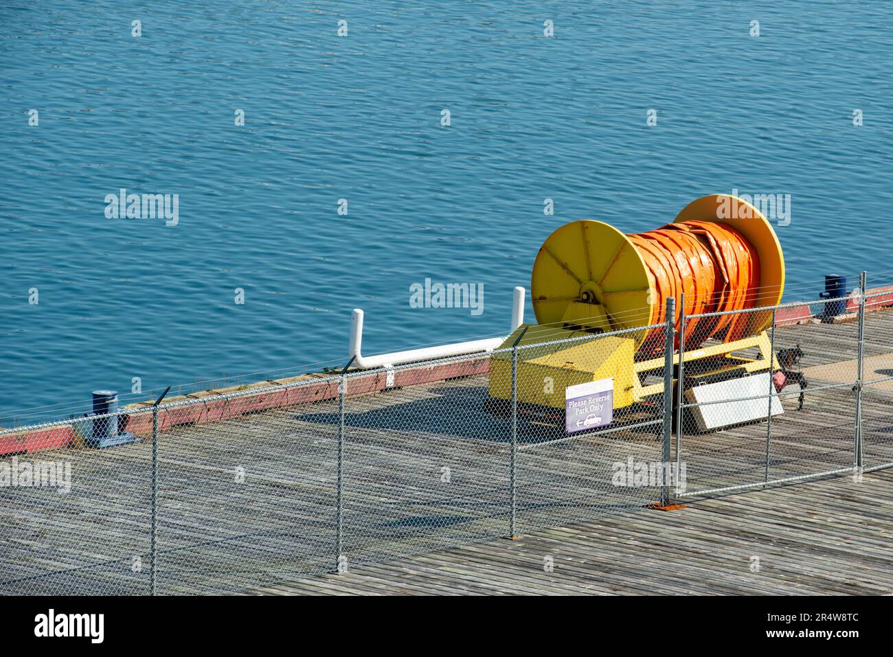 An industrial reel of orange oil sorbents spills containment boom ...