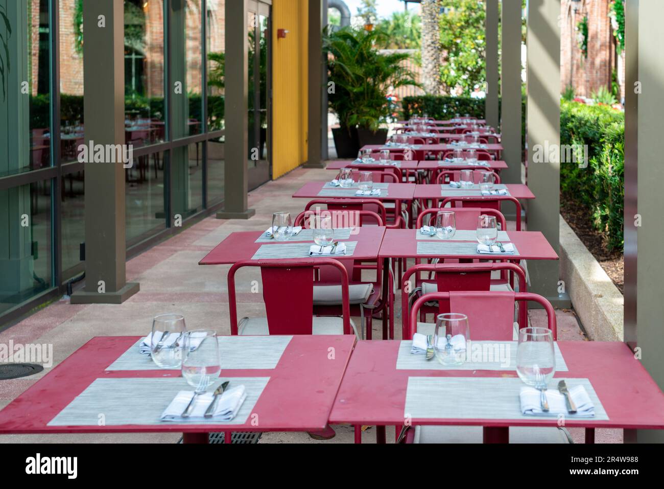 The exterior patio area of a small restaurant entrance with empty retro ...