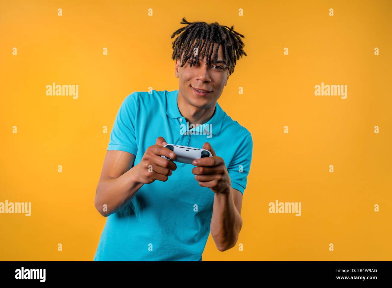 African teenager guy playing online video game, console TV with ...