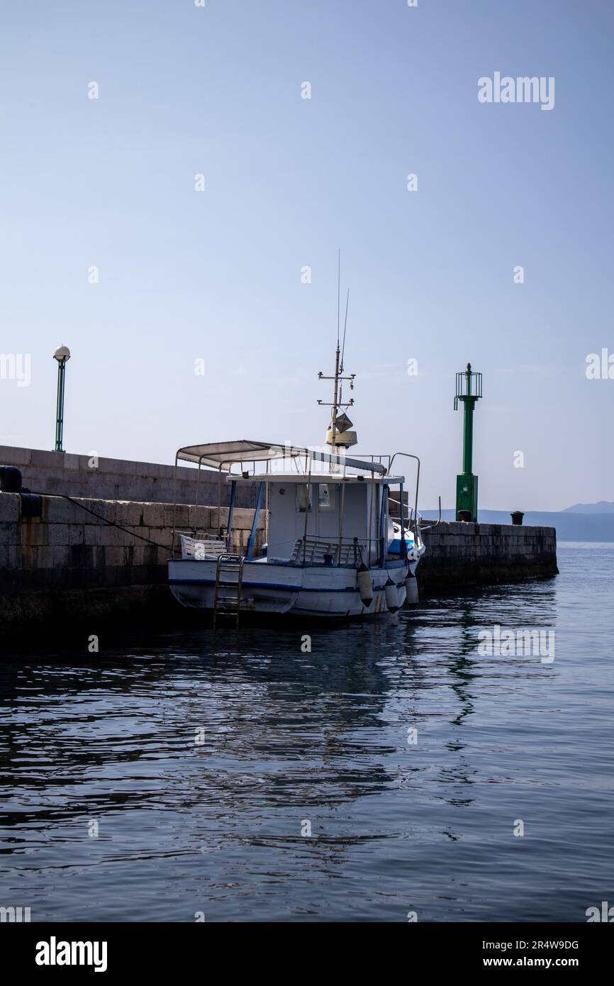 Fishing boat in a small port Stock Photo - Alamy