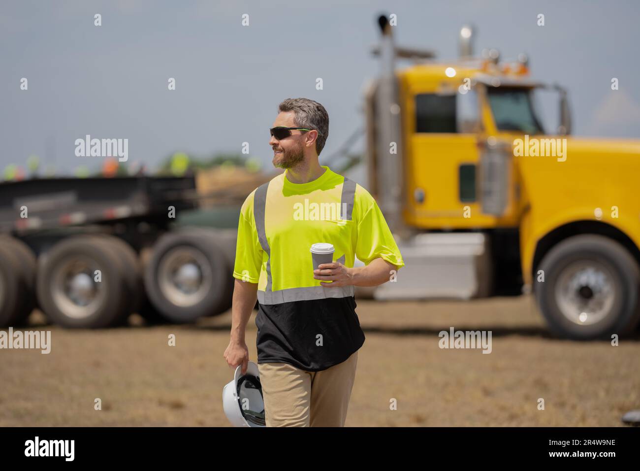 smiling worker at coffee break. male contractor at working location ...