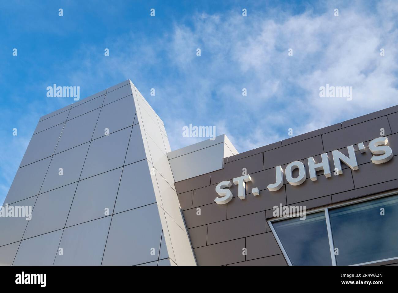The exterior wall of a contemporary commercial style grey colored ...