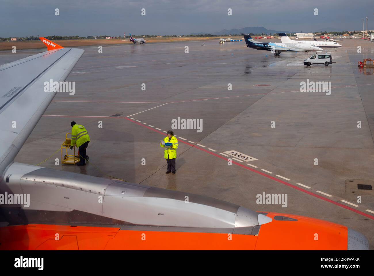Alicante Elche Airport. Ground handling worker with checklist outside ...