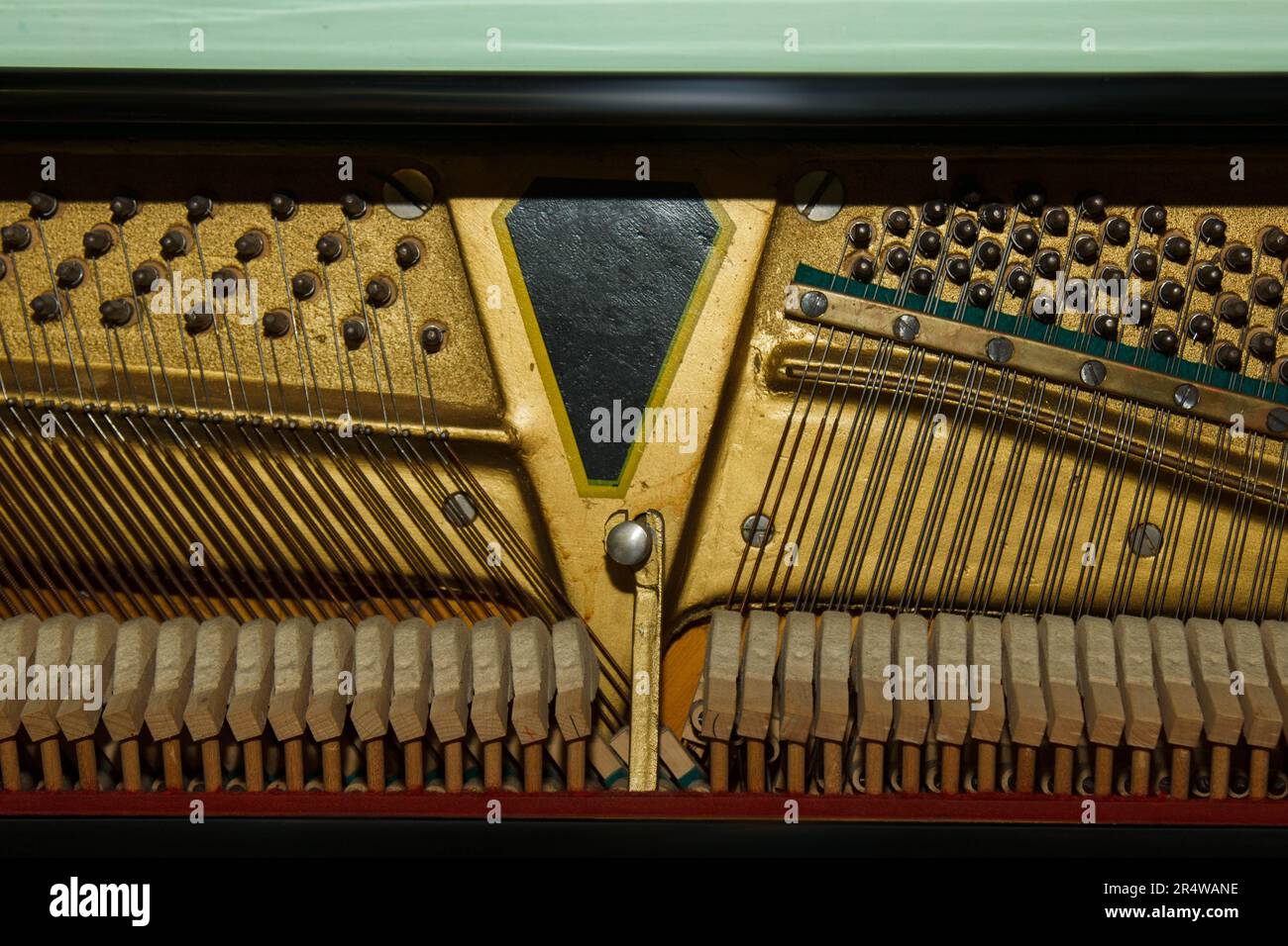 Repair of a stringed musical instrument. The interior of a piano with ...