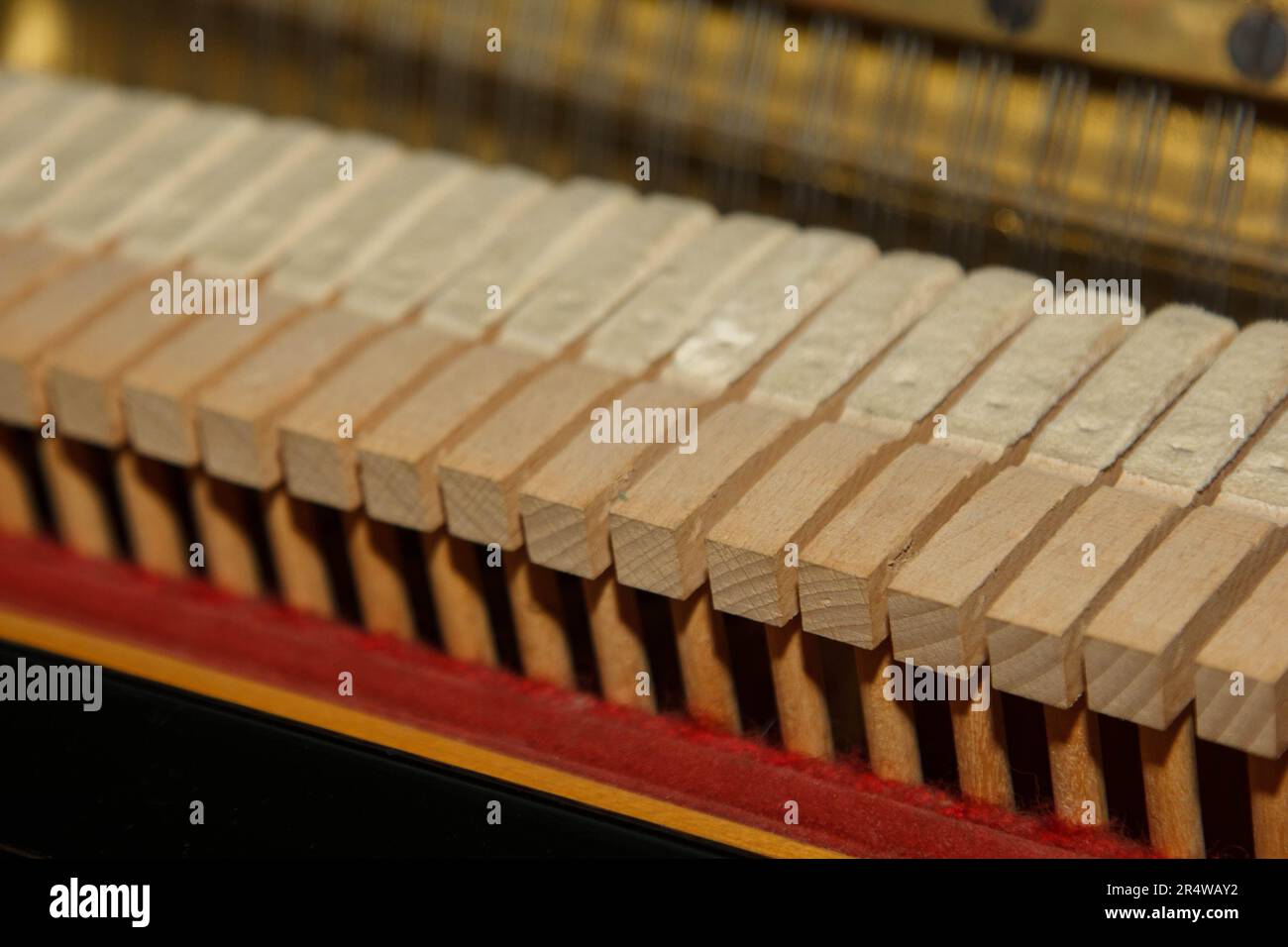 Internal parts of an old piano close-up - mechanics, strings. Selective ...