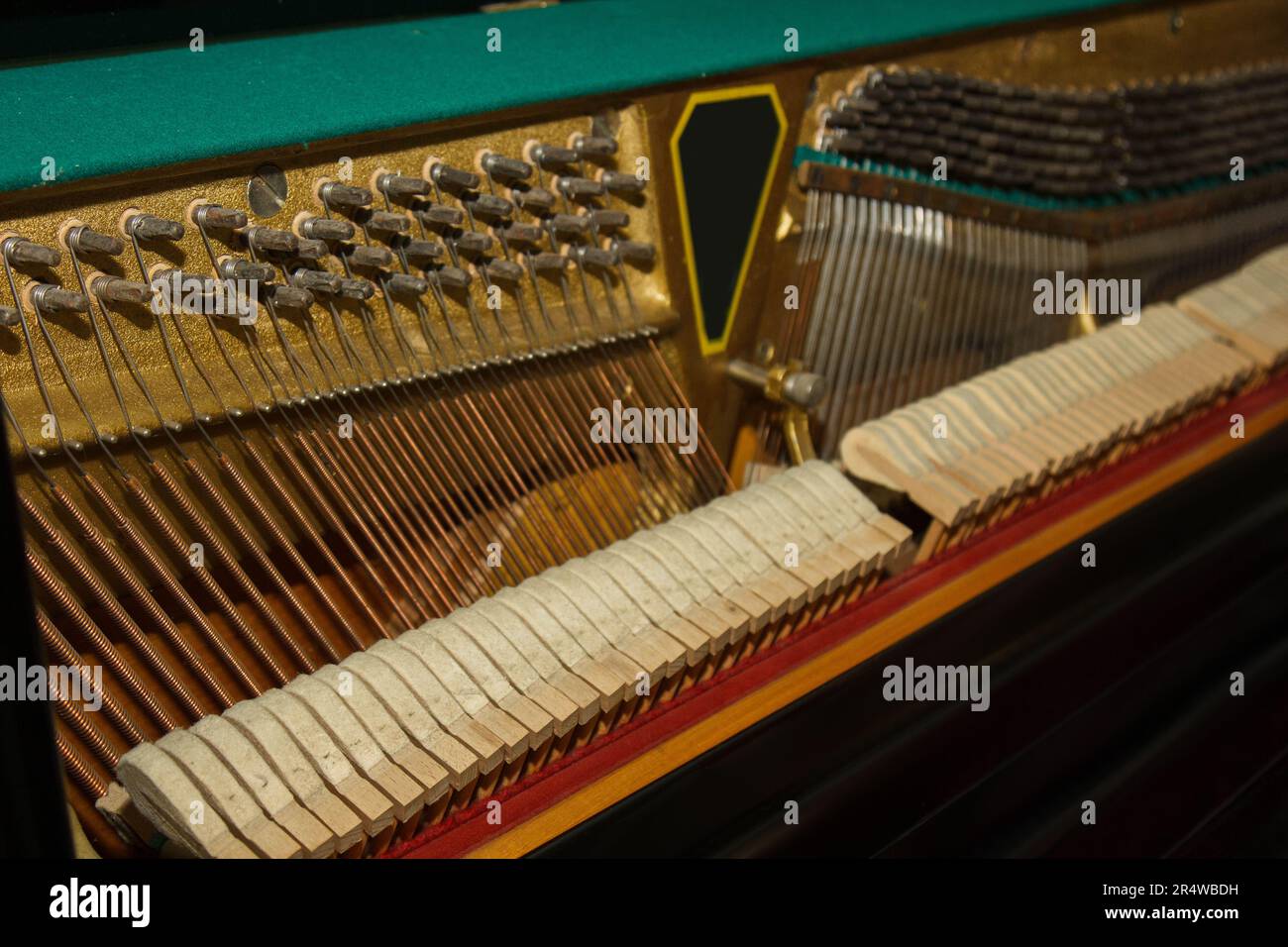 A close-up of the internal parts of a piano or grand piano. Selective ...
