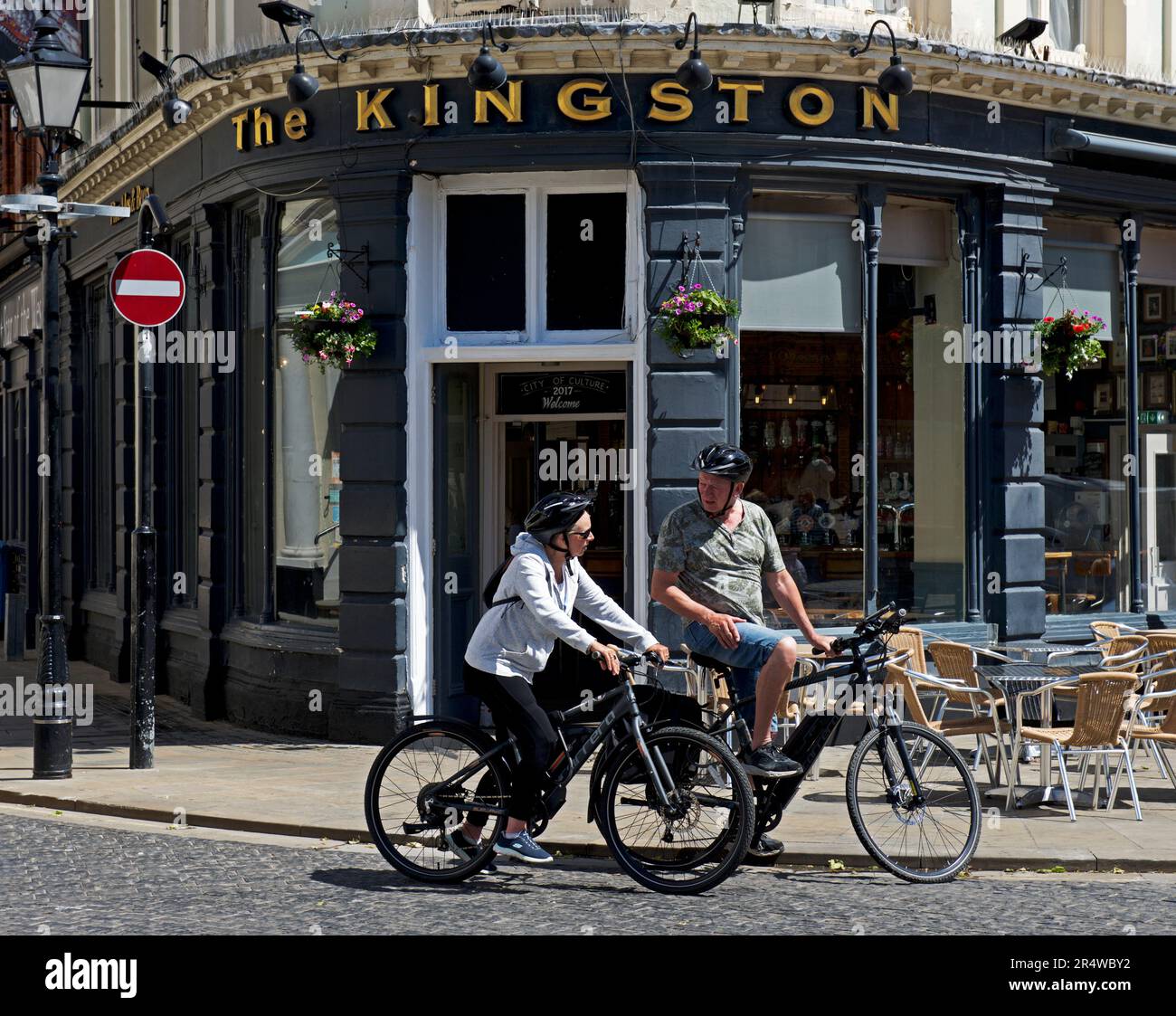 Cyclists outside the Kingston pub in Trinity Square, Hull, Humberside ...