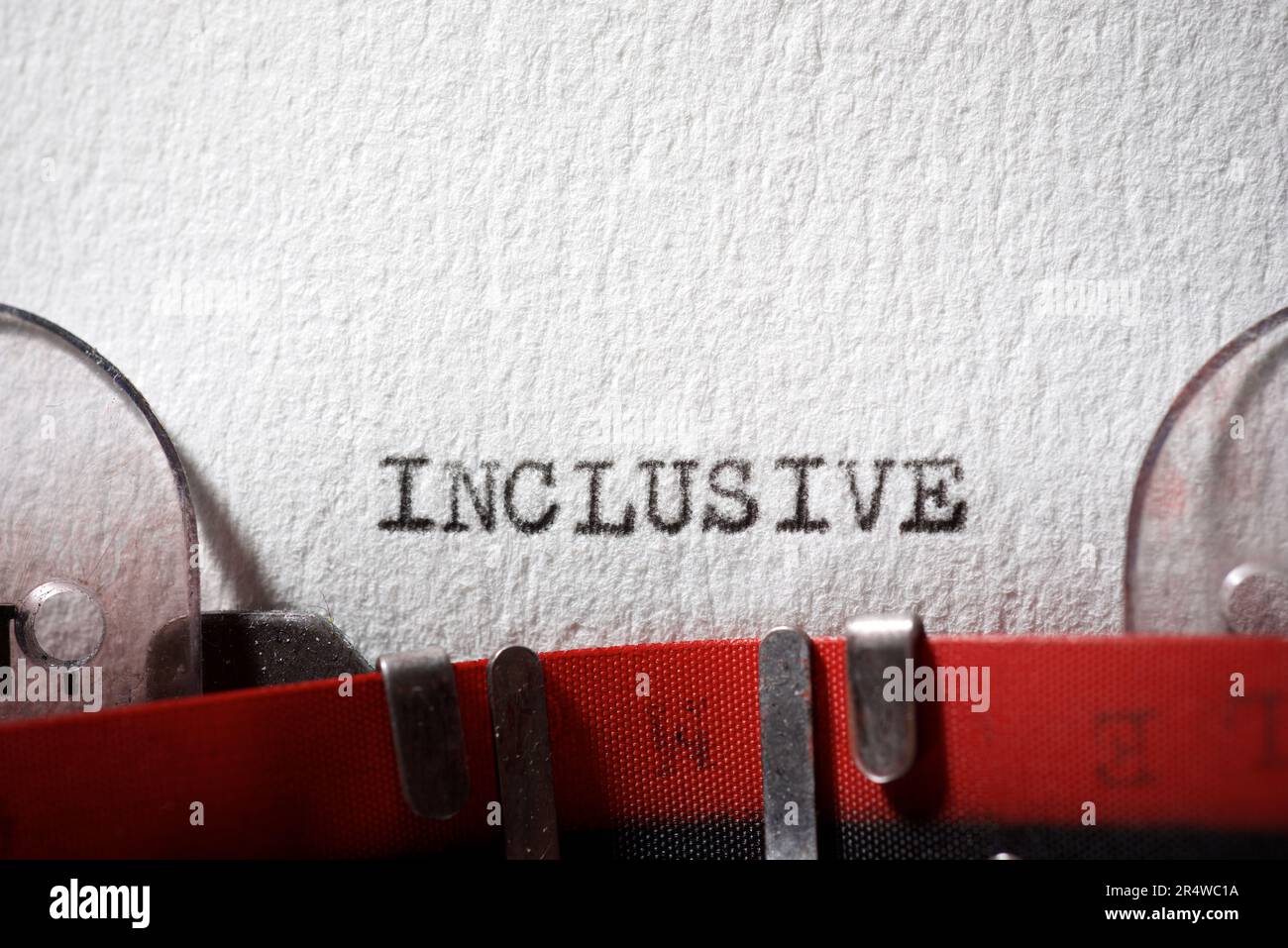 Inclusive word written with a typewriter Stock Photo - Alamy