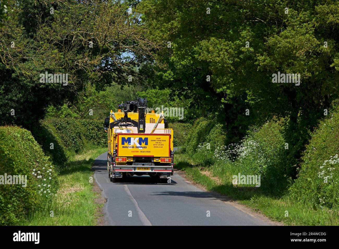 MKM lorry, carrying builders materials, on single track Breighton Road ...